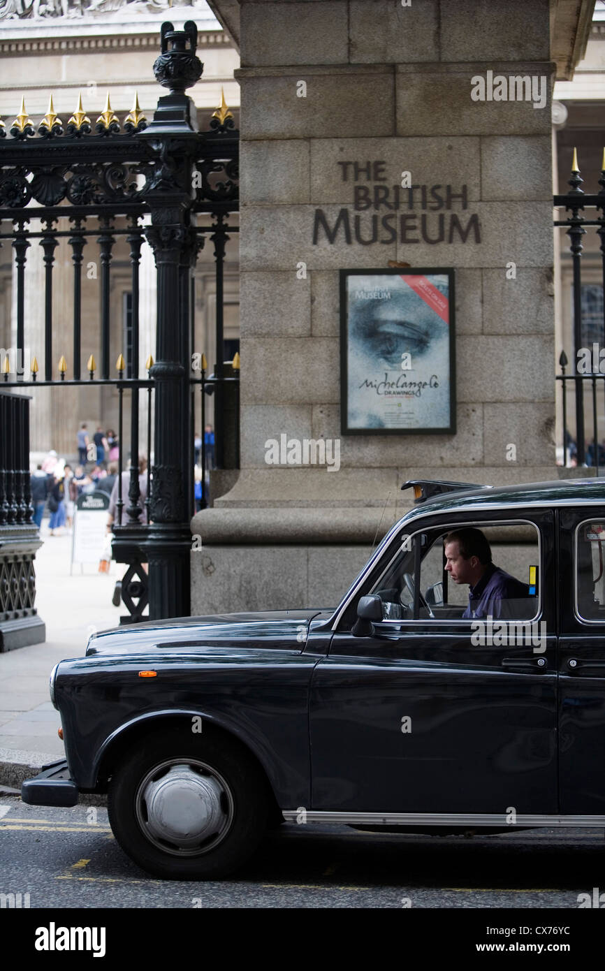 London black taxi cab parked outside the front entrance to the British ...