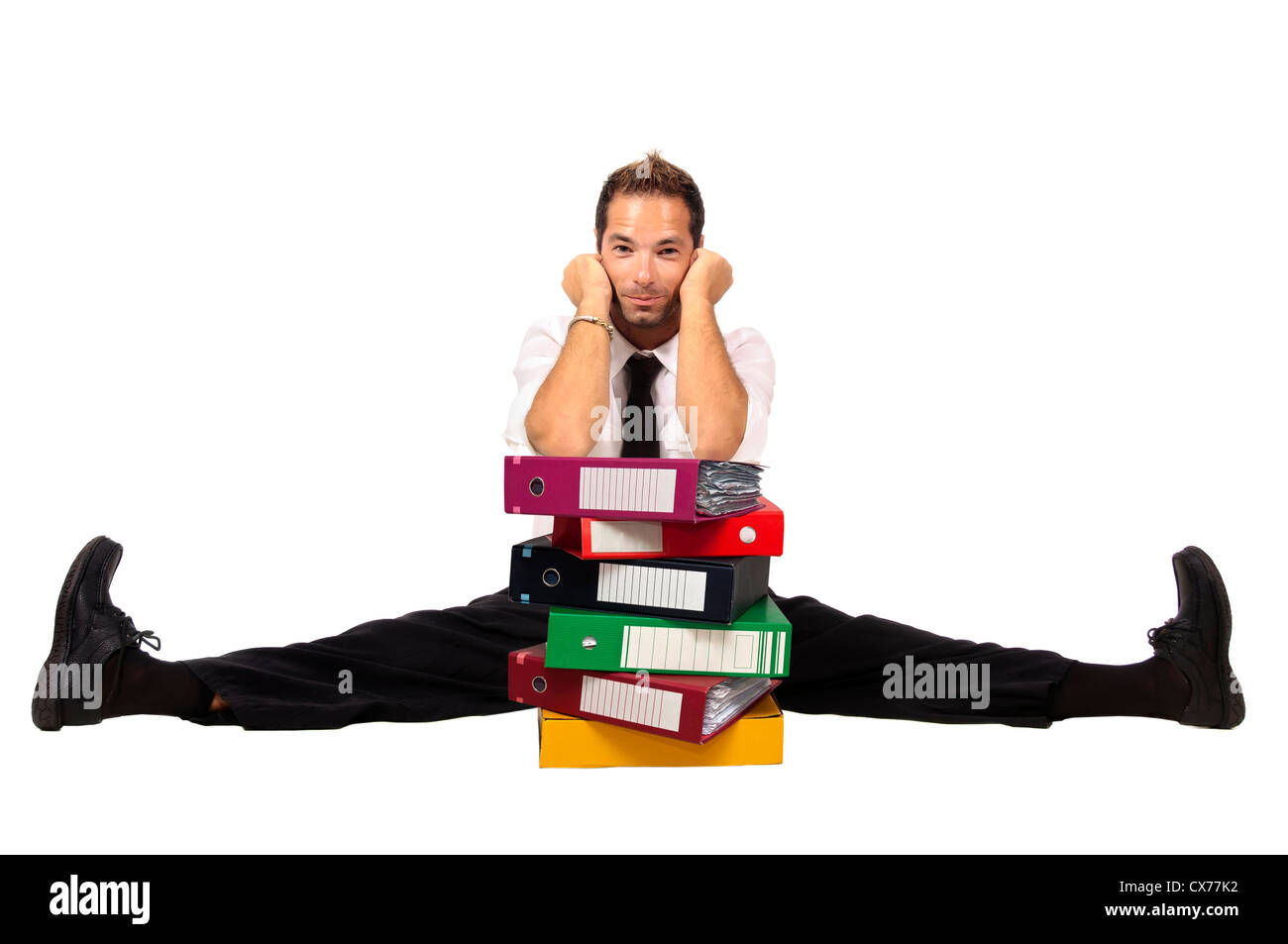 Businessman doing splits with a stack of files Stock Photo - Alamy