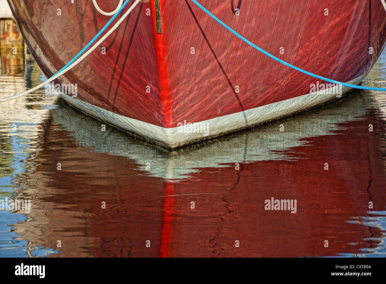 Colorful Sailboat Hull and Reflection Stock Photo - Alamy