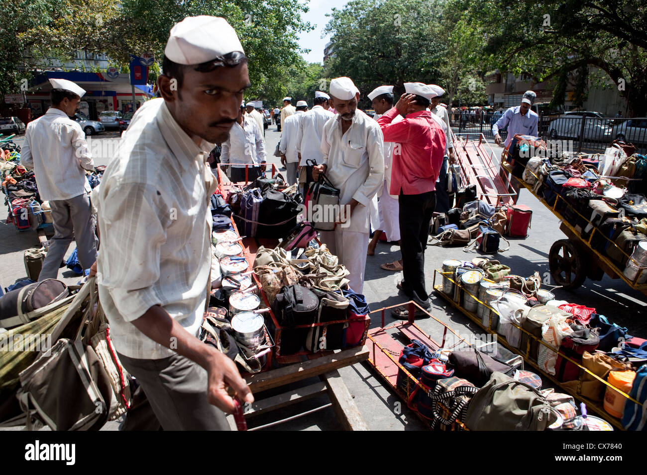 The Dabbawalla lunch delivery men sorting through lunches on the ...