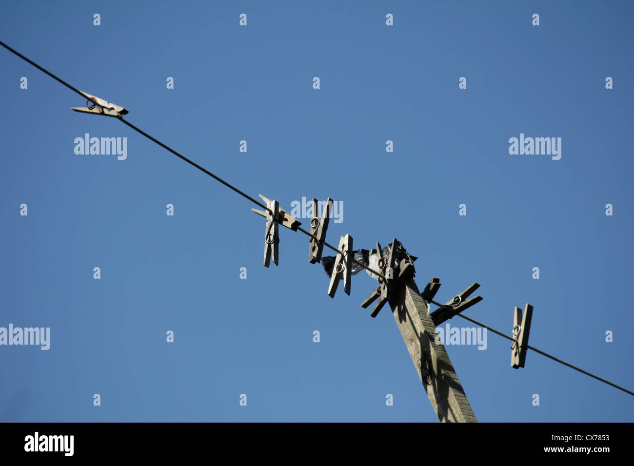 old clothes washing line and blue sky Stock Photo - Alamy