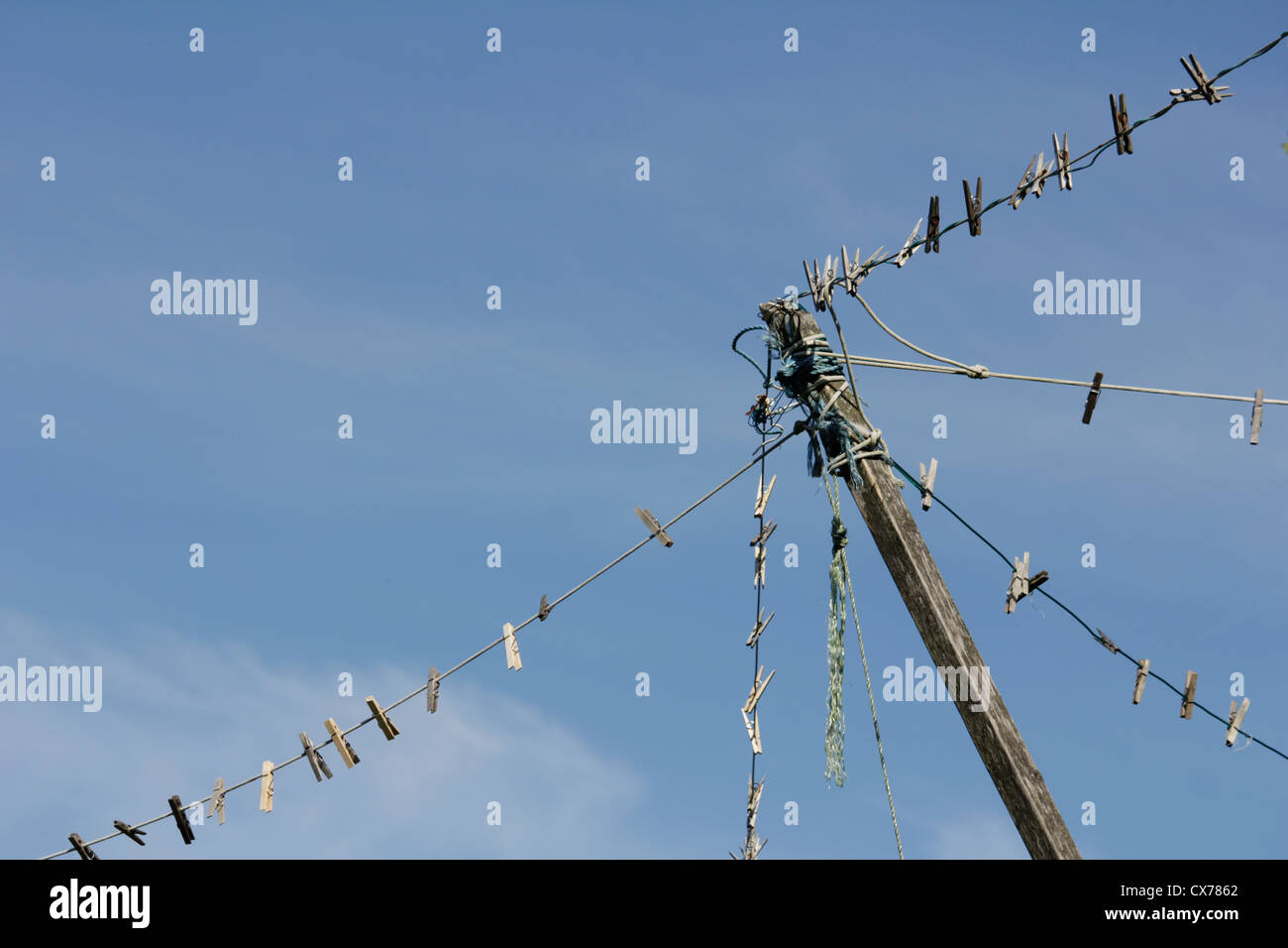 old clothes washing line and blue sky Stock Photo - Alamy