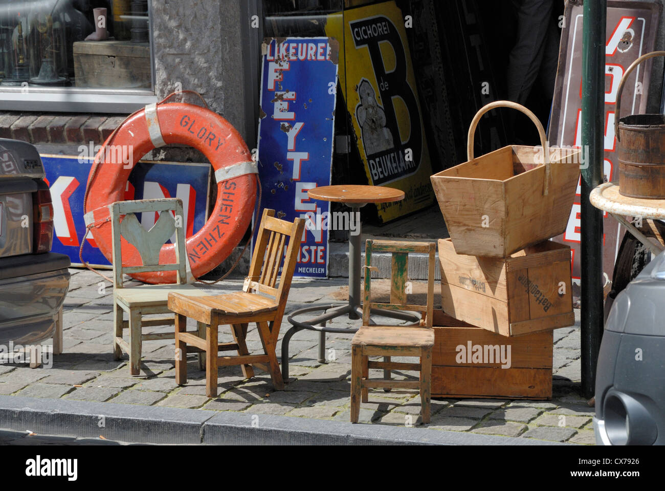 Brussels, Belgium. Odd collection of objects on pavement outside junk ...