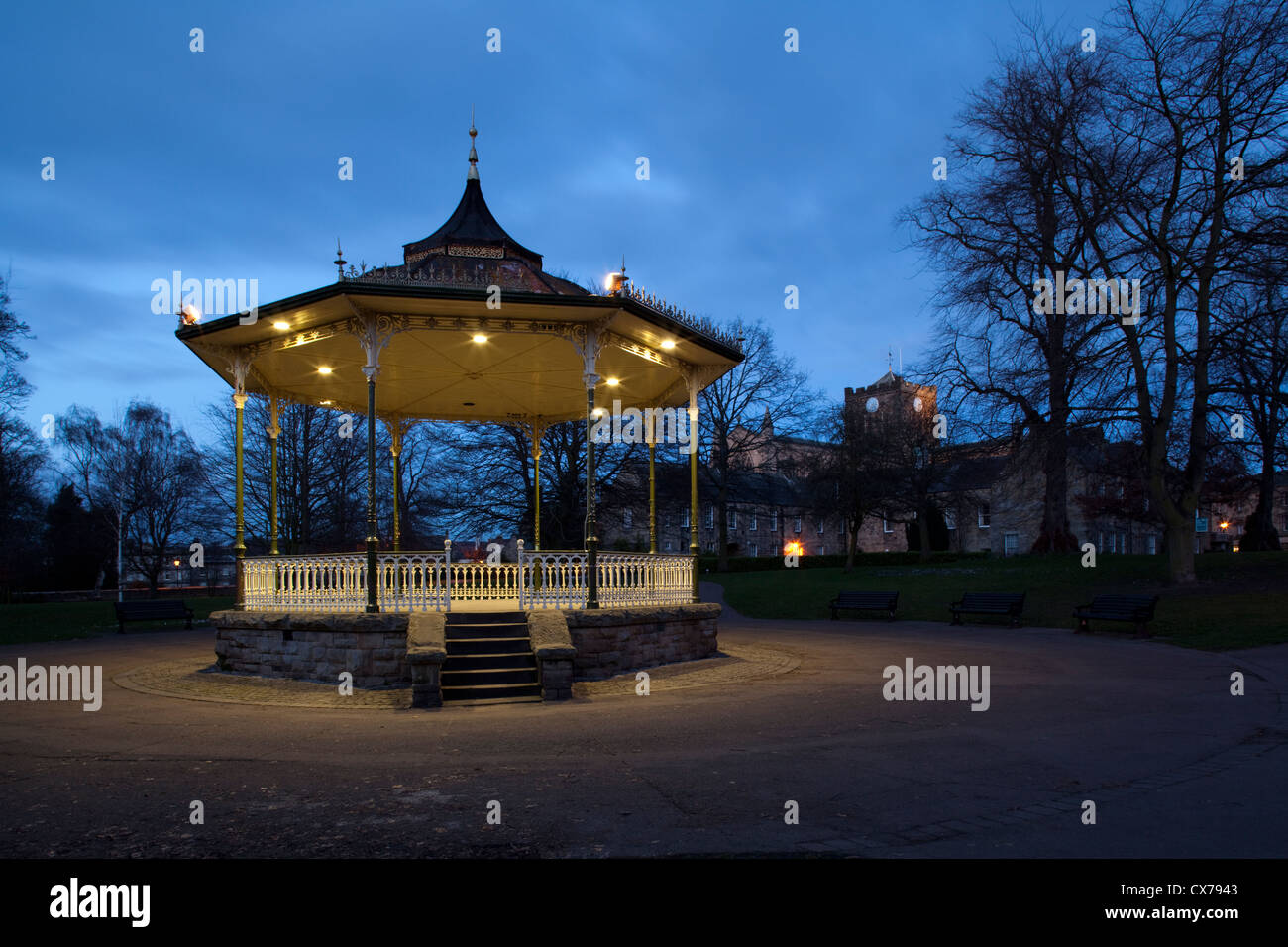 Bandstand in Hexham Park at night with floodlit Abbey. Northumberland ...