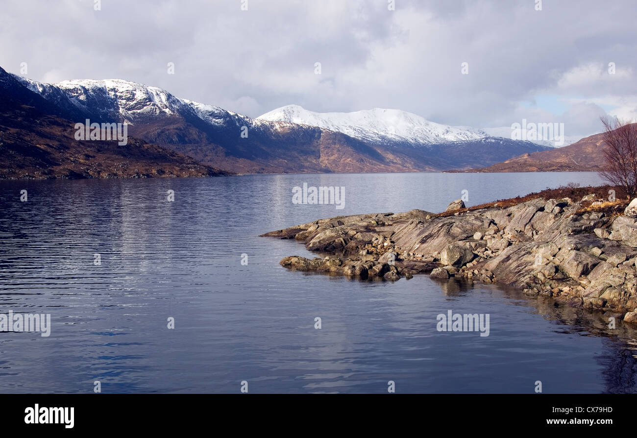 Scottish loch with snow topped hills Stock Photo - Alamy