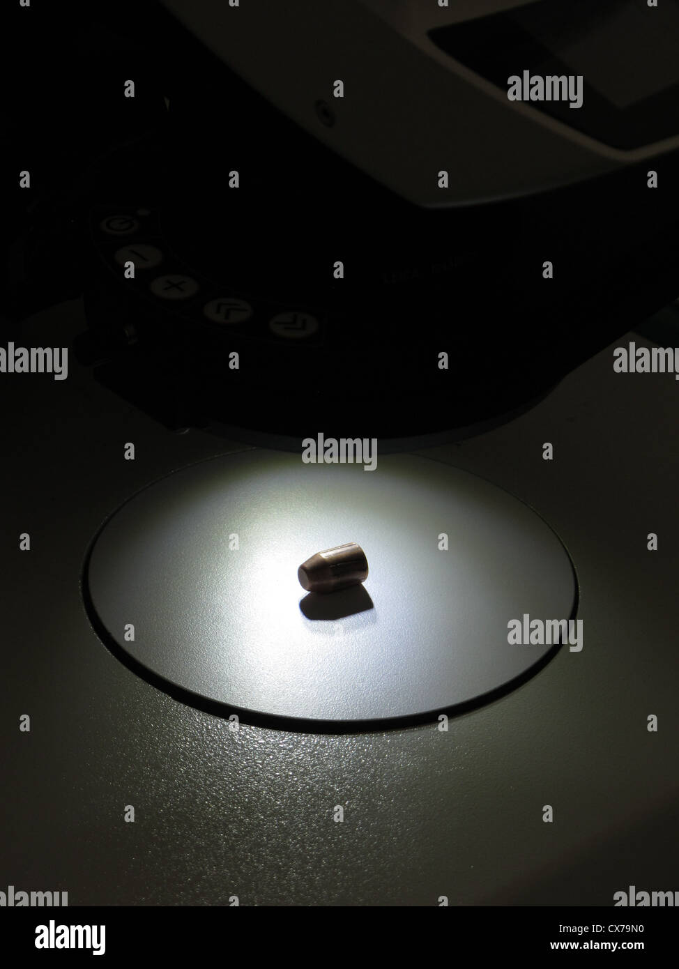 one bullet under a microscope at forensic lab at police event Stock ...