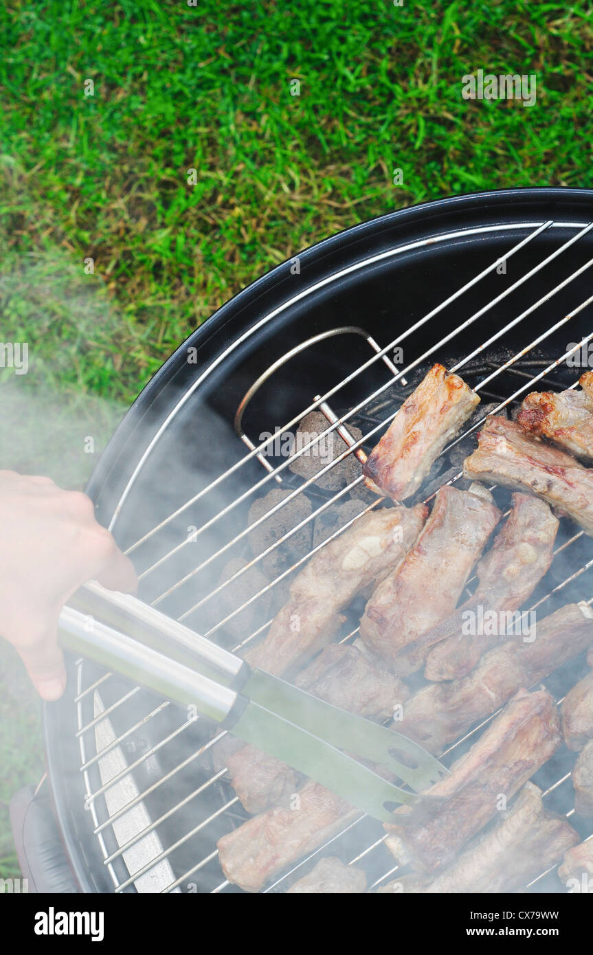 Barbecue Pork Ribs in a small portable barbeque Stock Photo - Alamy