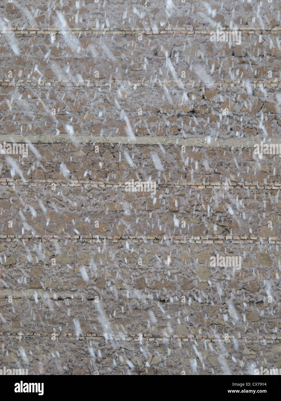 snow falling by wall Stock Photo - Alamy