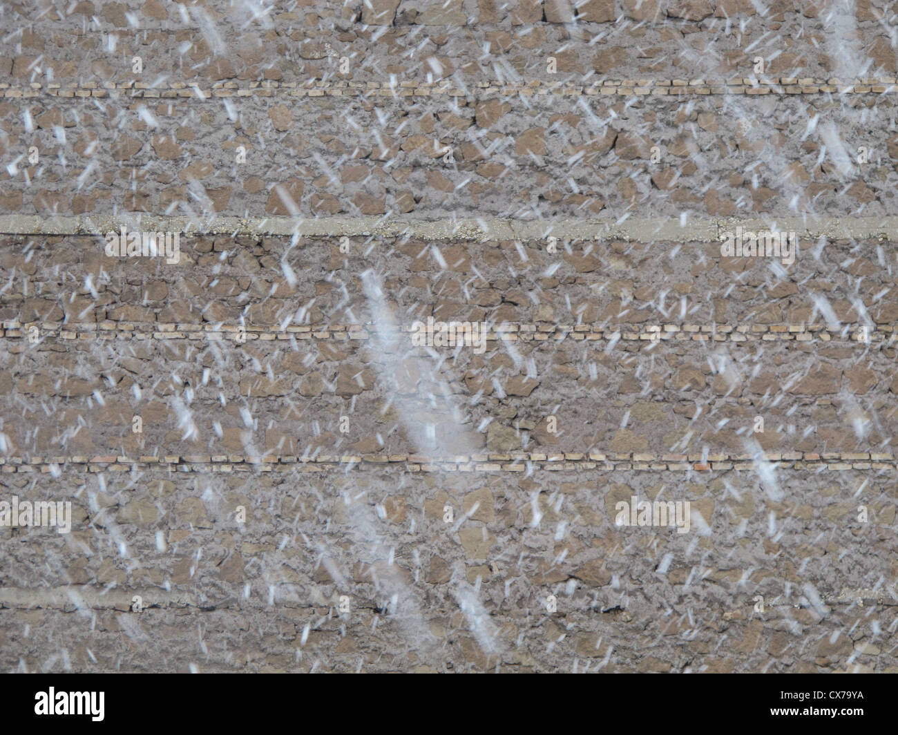 snow falling by wall Stock Photo - Alamy
