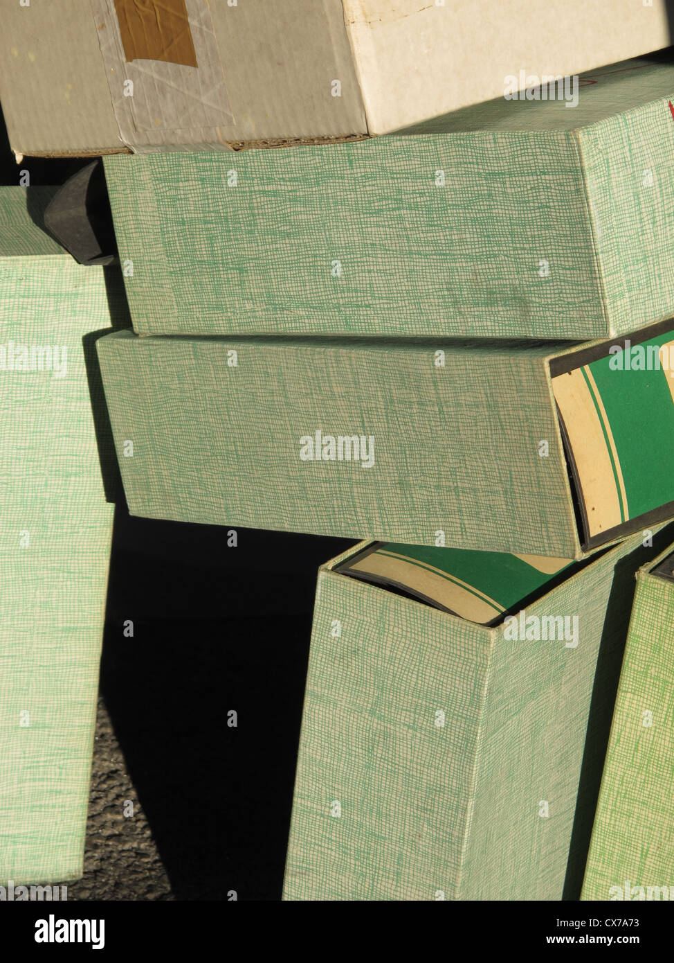 pile of box files dumped in street road Stock Photo - Alamy