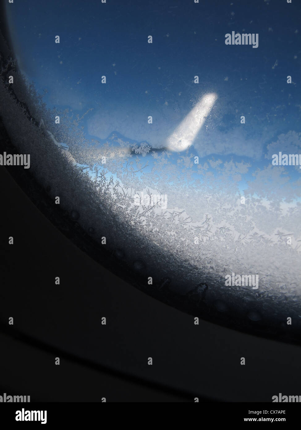 plane window covered with ice Stock Photo - Alamy