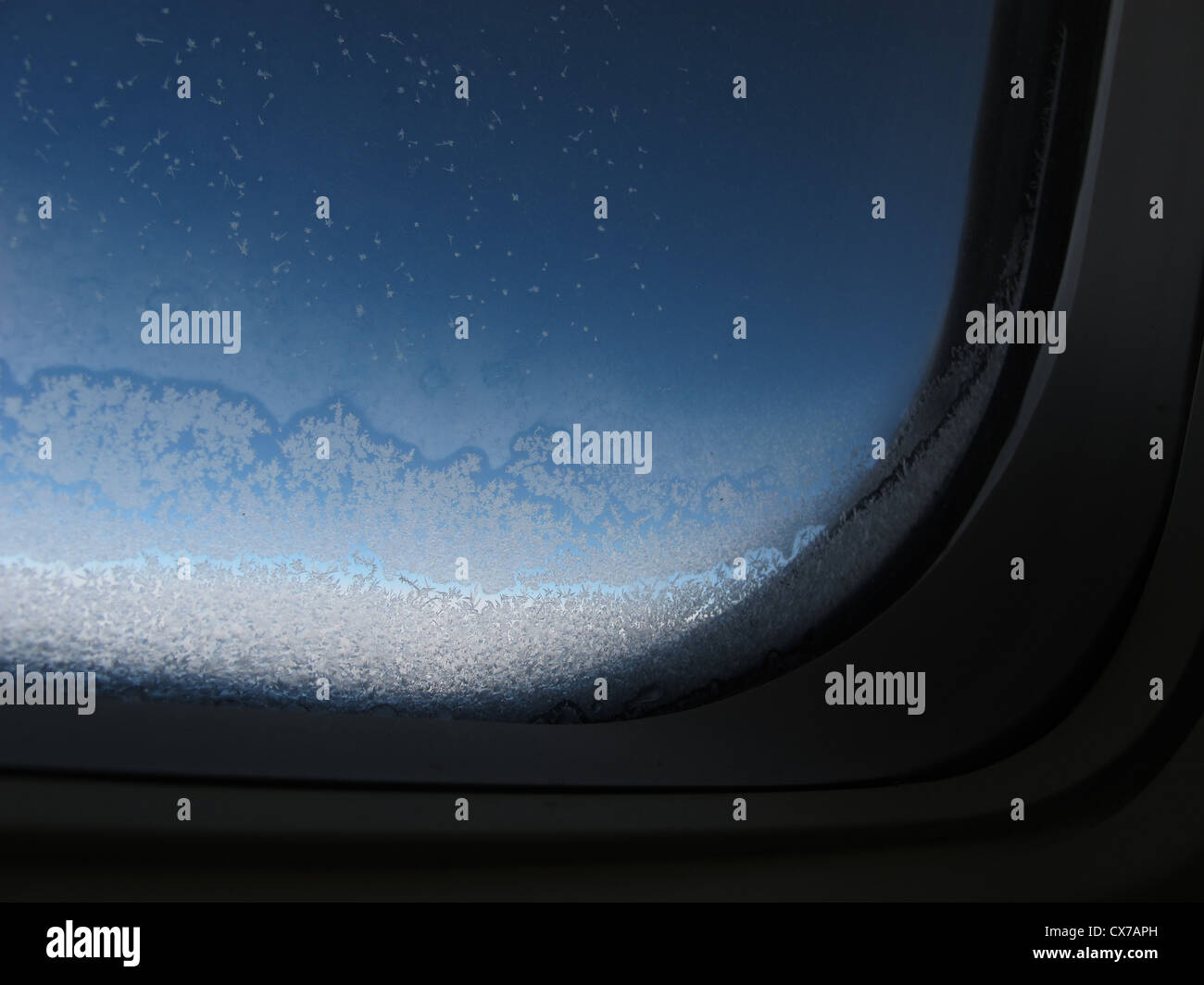 plane window covered with ice Stock Photo - Alamy