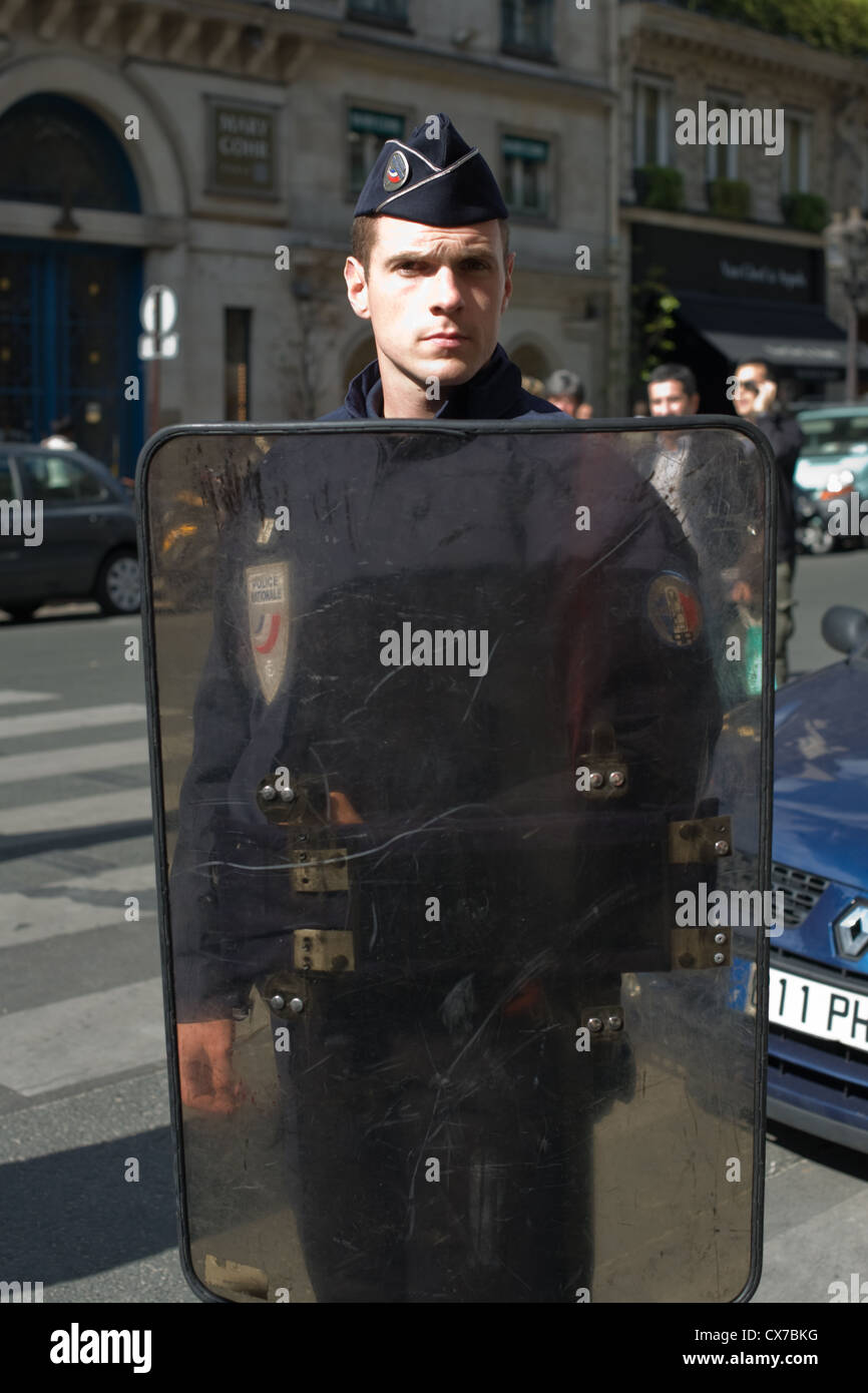 Paris, France, September 19, 2012. A Police officer with a riot shield ...