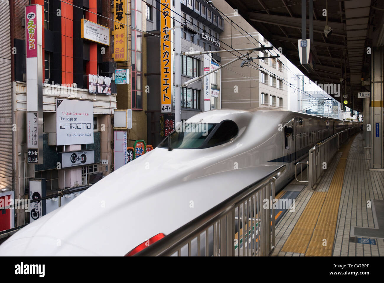 Japanese High Speed Train Waiting At The Station With Buildings Close ...