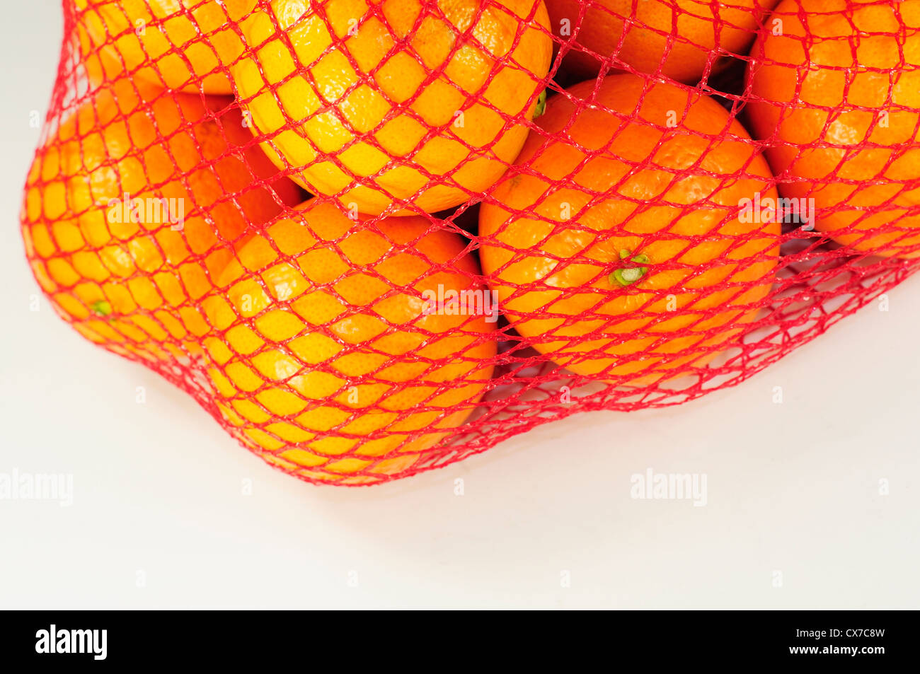 Orange Fruit in Net Bag Stock Photo - Alamy