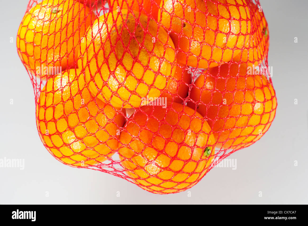 Orange Fruit in Net Bag Stock Photo - Alamy