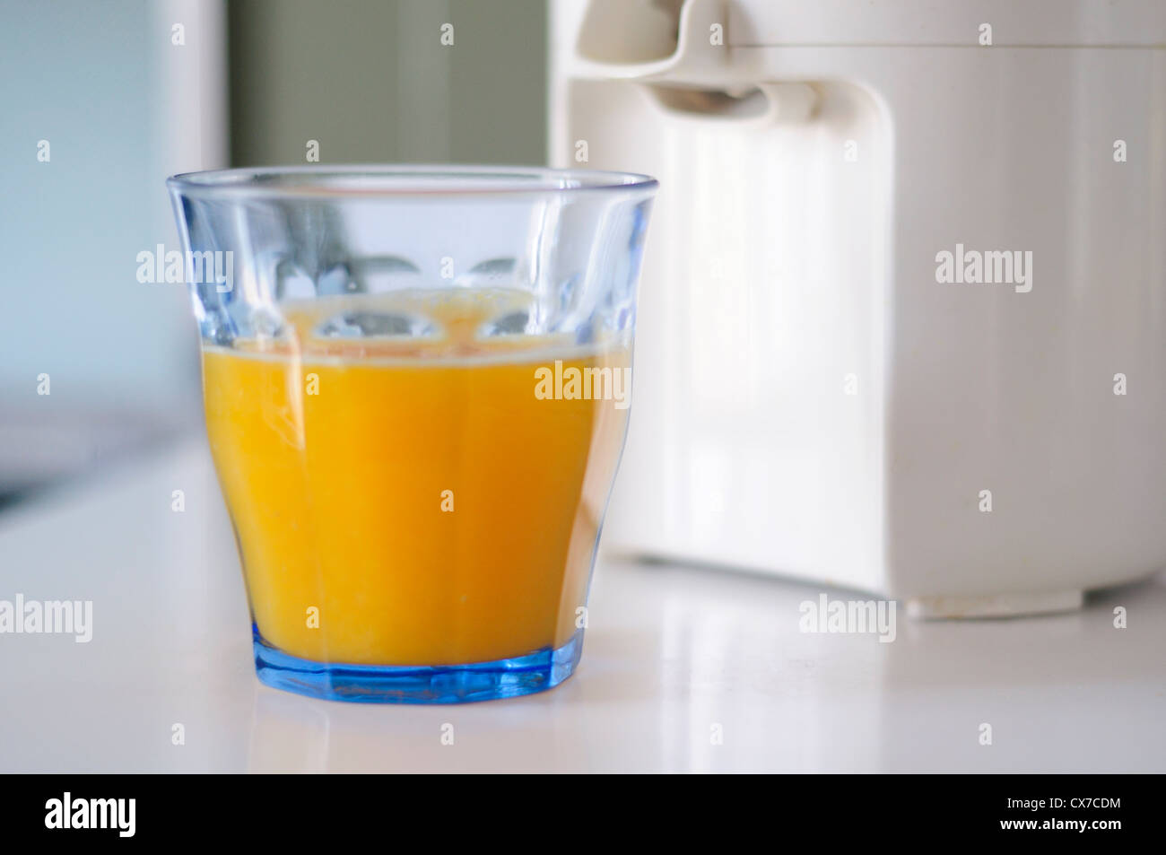 Glass of Orange Juice whit Squeezing Machine Stock Photo - Alamy