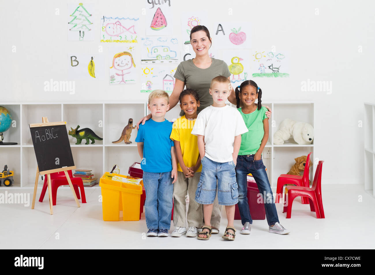 kindergarten kids and teacher in classroom Stock Photo - Alamy