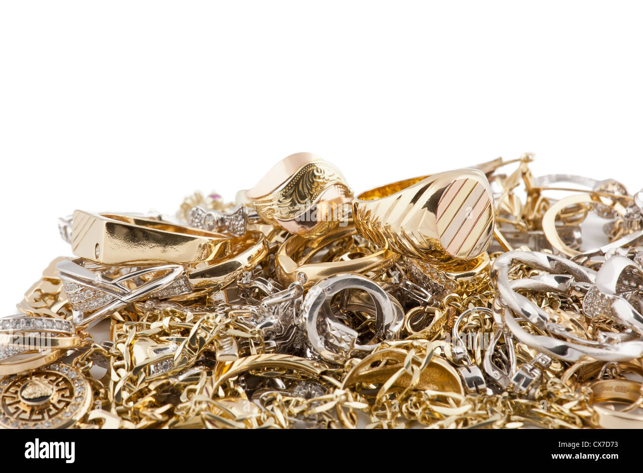 Gold jewelry on a white background Stock Photo - Alamy
