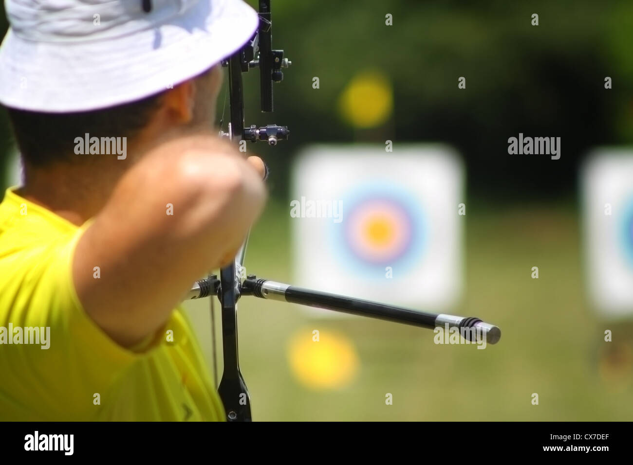 Aiming archer on archery range is concentrated and ready to fire Stock ...