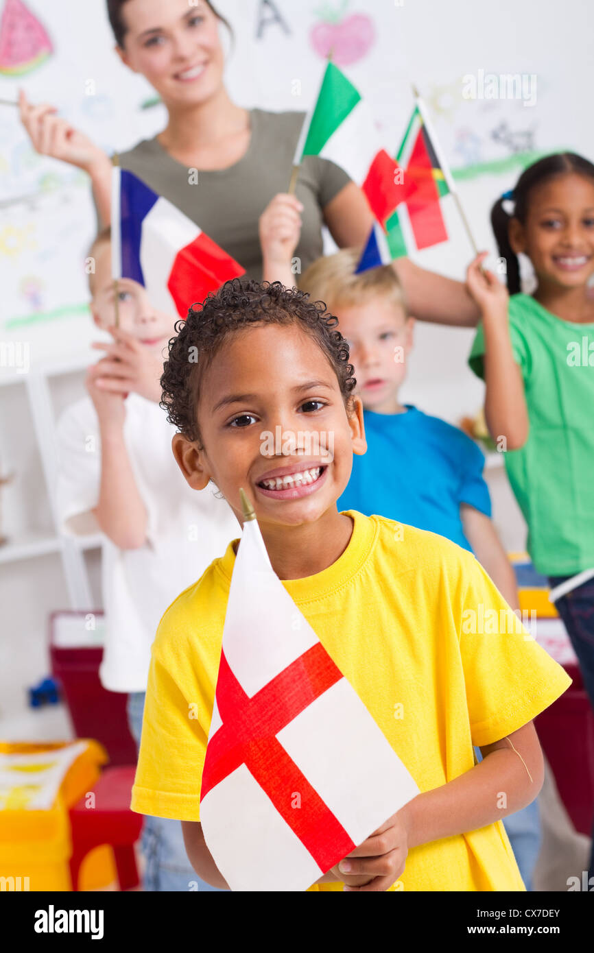 group of preschool kids and teacher with flags in classroom Stock Photo ...
