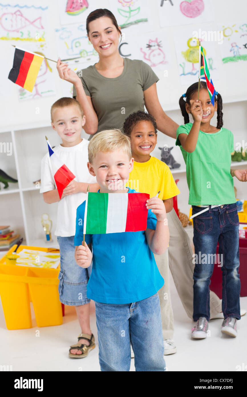 group of preschool kids with flags in classroom Stock Photo - Alamy