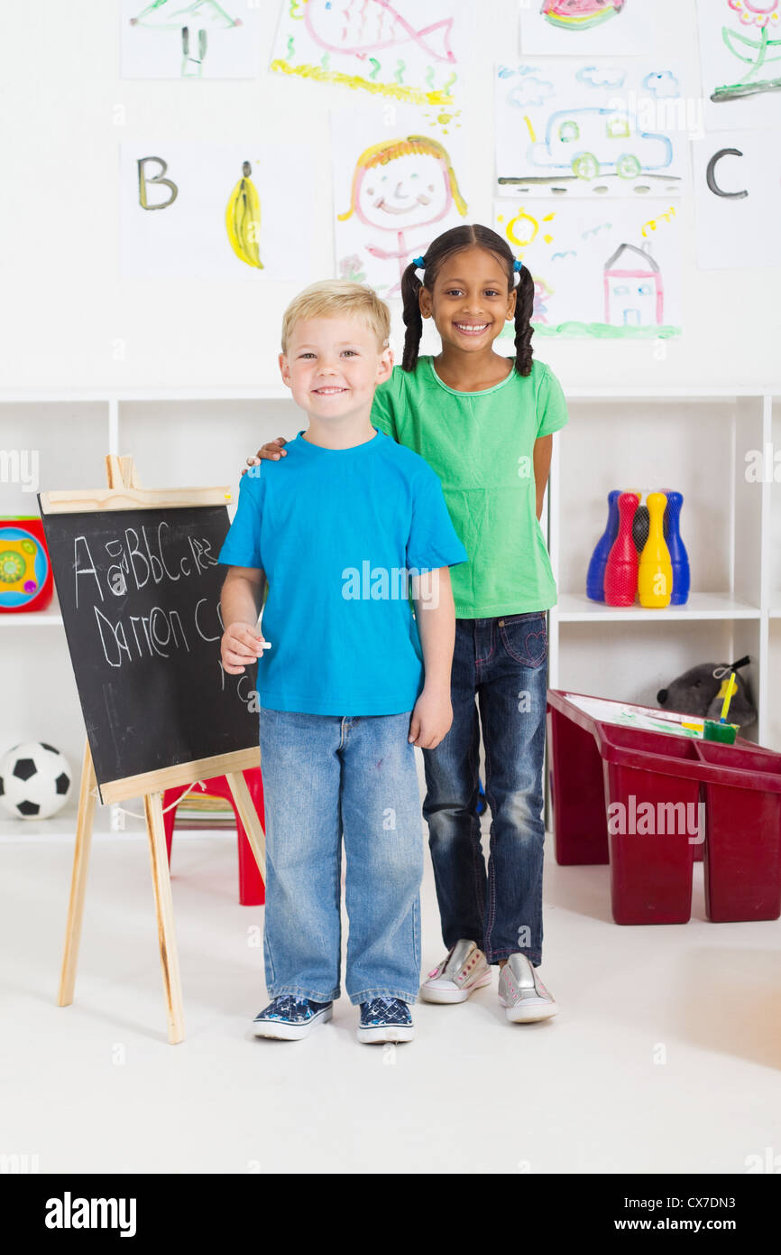 two little classmates in preschool classroom Stock Photo - Alamy