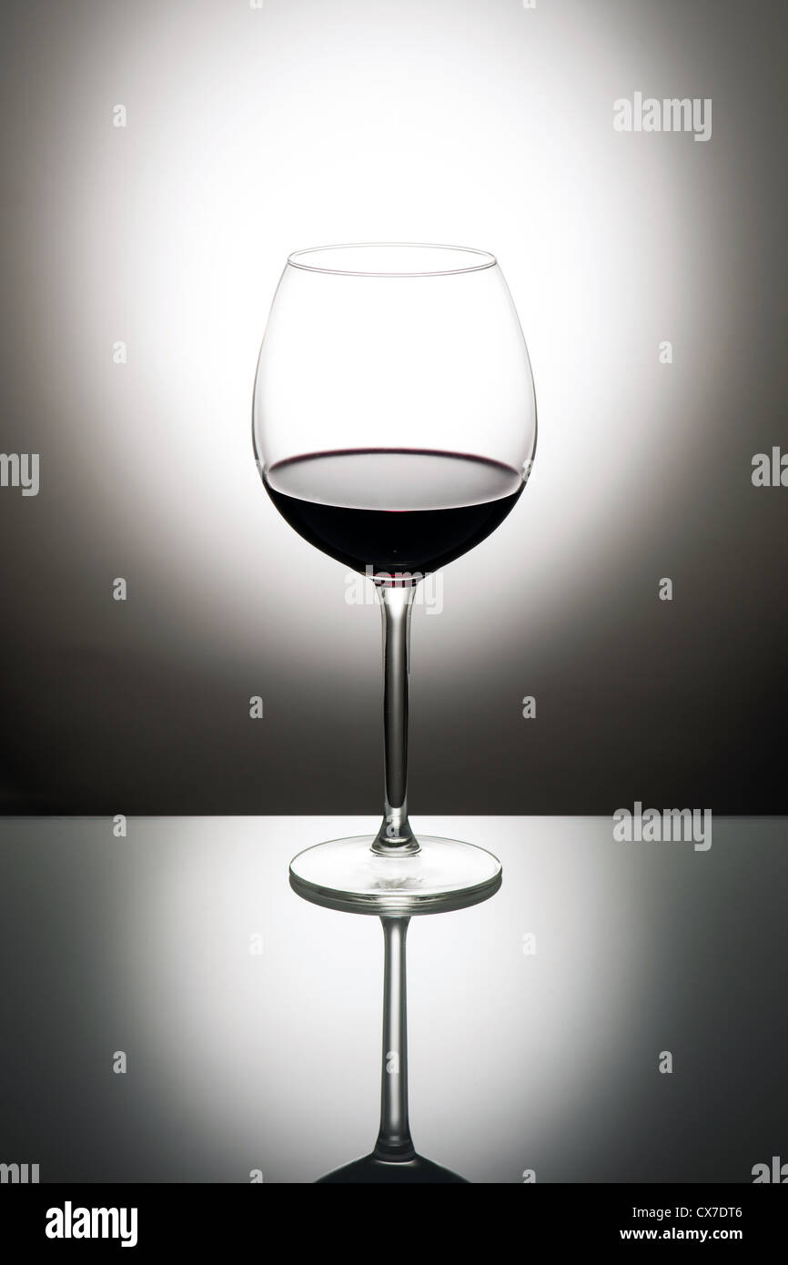Glass of red wine with reflection on white background Stock Photo - Alamy