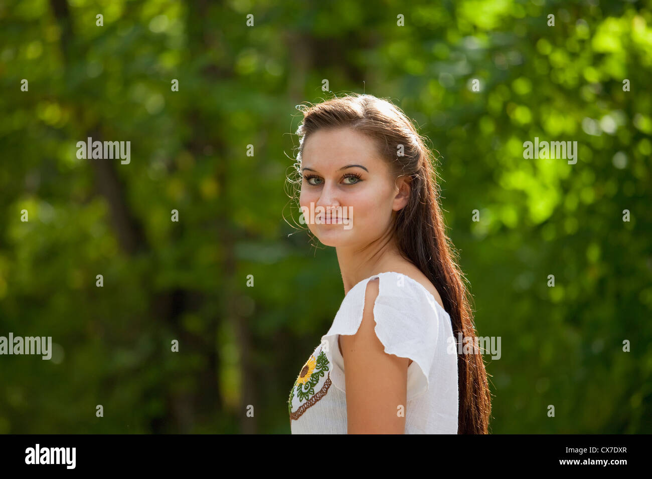 Portrait Of A Young Woman In A Park; Edmonton, Alberta, Canada Stock ...