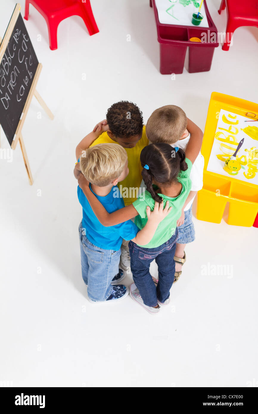 overhead view of group of preschool kids hugging Stock Photo - Alamy