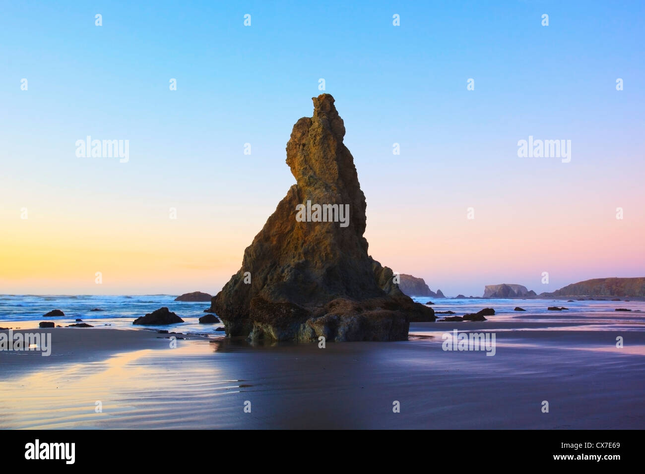 Rock Formations Reflecting In Tide Pools At Low Tide On Bandon Beach At ...