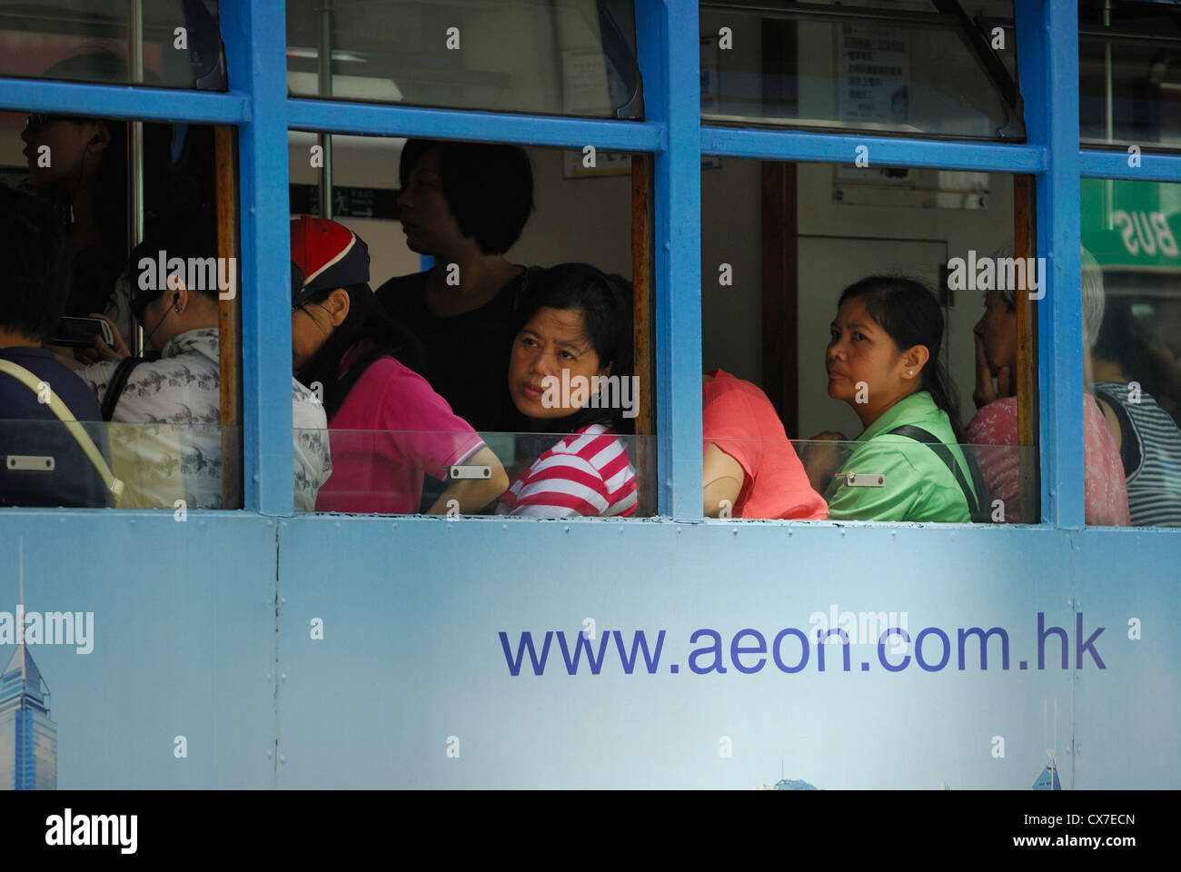 Passengers inside a Hong Kong trolley bus Stock Photo - Alamy