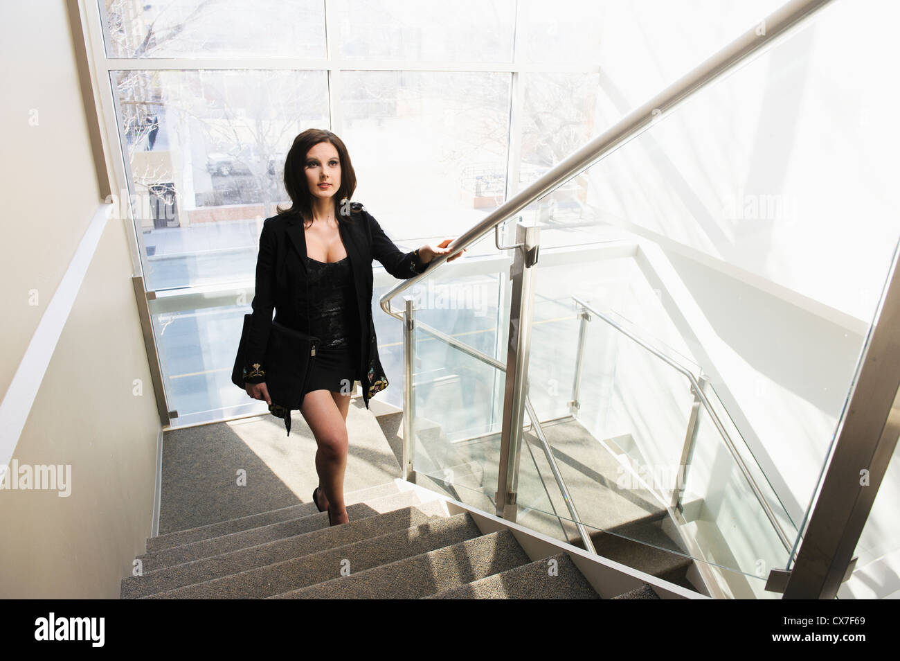 Female climbing window hi-res stock photography and images - Alamy