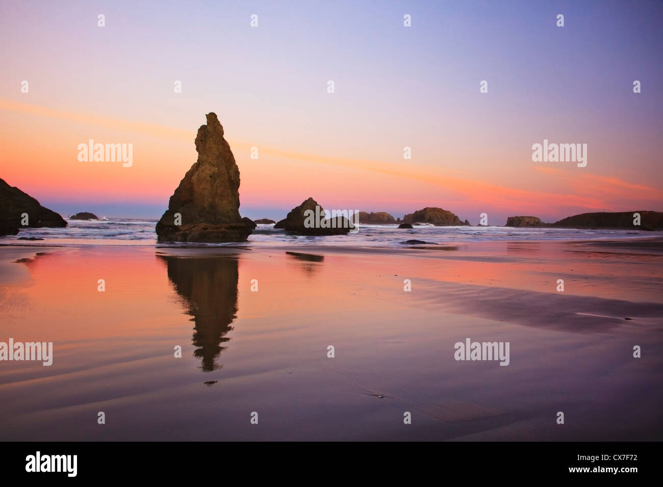 Sunset Over Rock Formations Reflecting In Tide Pools At Low Tide ...
