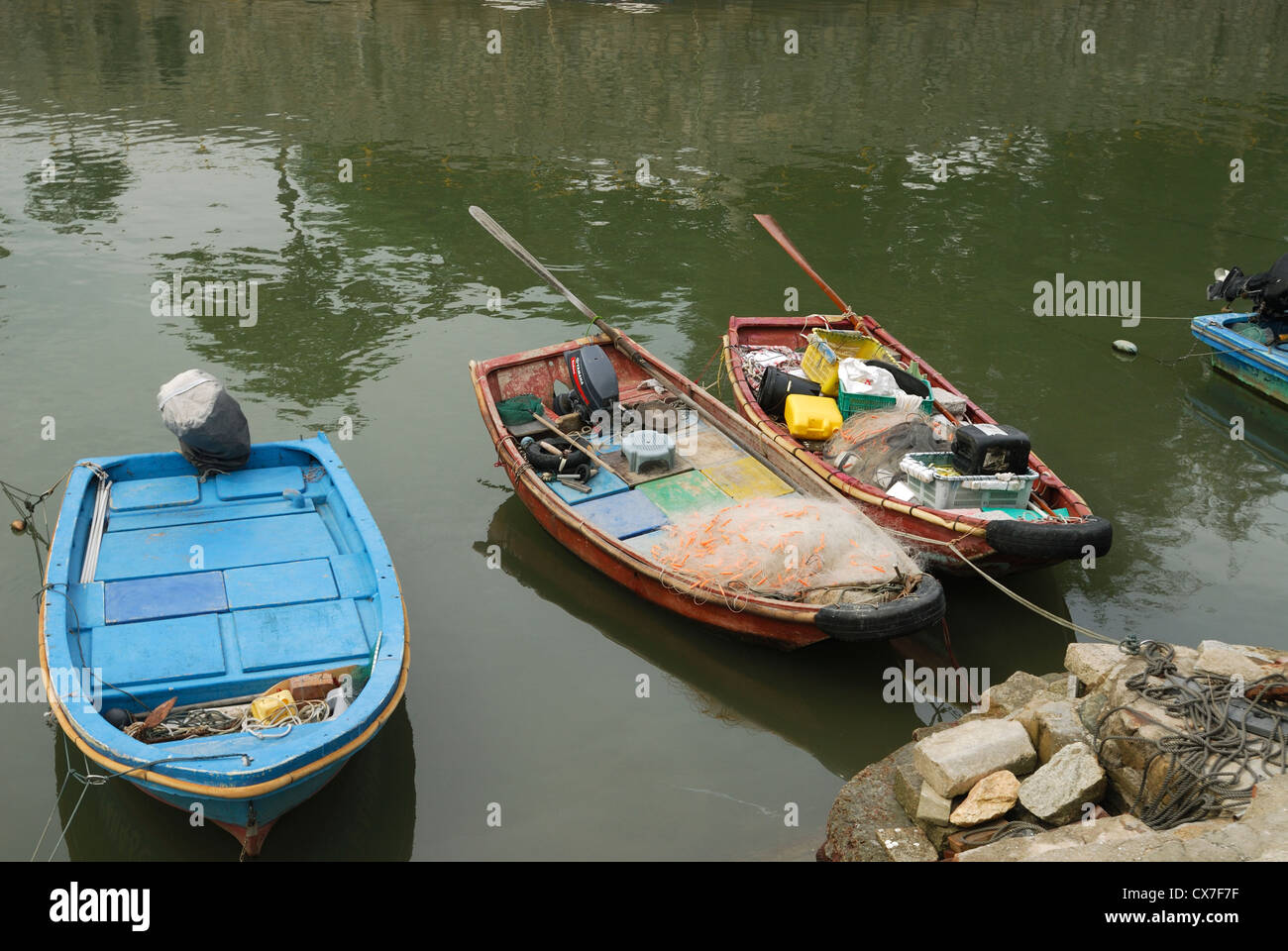 Small fishing boats moored on the Silvermine river canal. Mui Wo Lantau ...