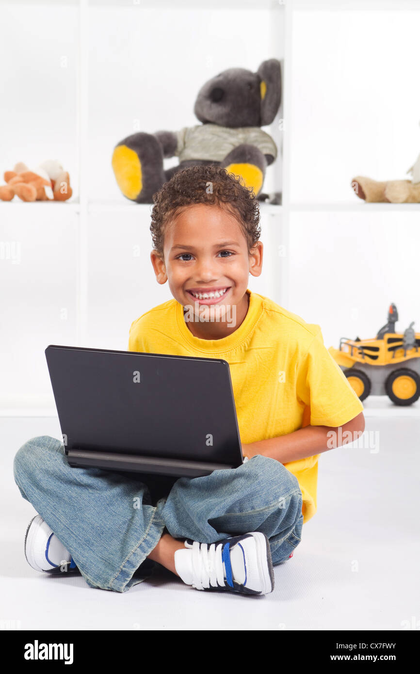 young african american boy playing on laptop computer Stock Photo - Alamy