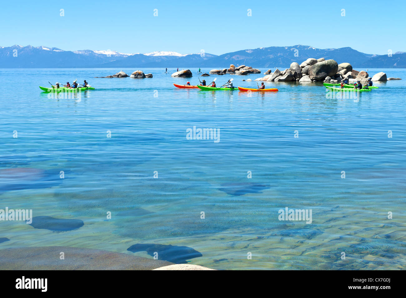 Team of kayaks paddling together in Lake Tahoe, CA Stock Photo - Alamy