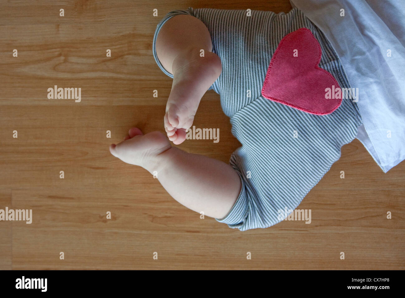 Baby girl crawling Stock Photo - Alamy