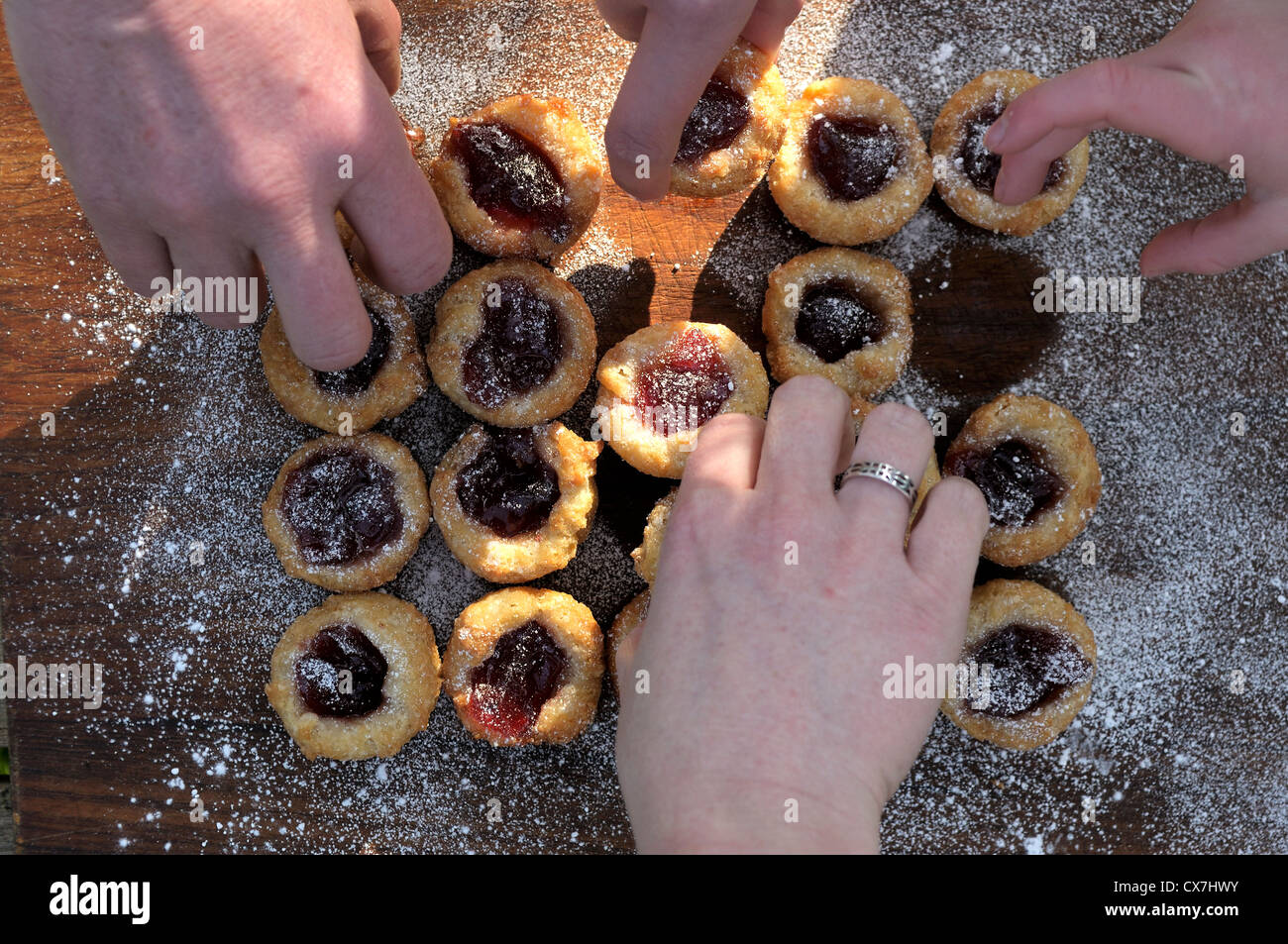 People Taking Jam Tarts Stock Photo - Alamy