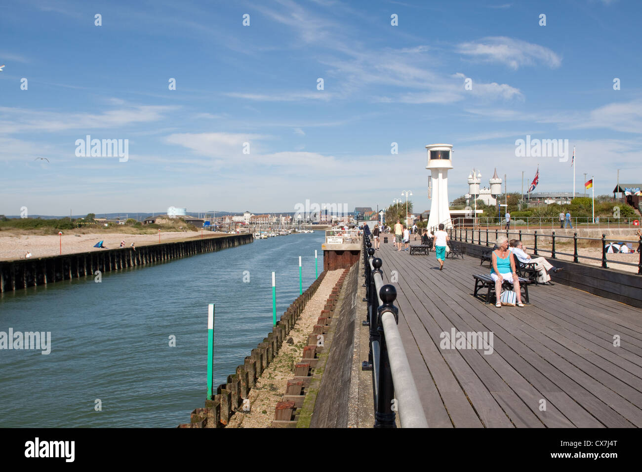 A view looking down the River Arun and the East Pier in Littlehampton ...