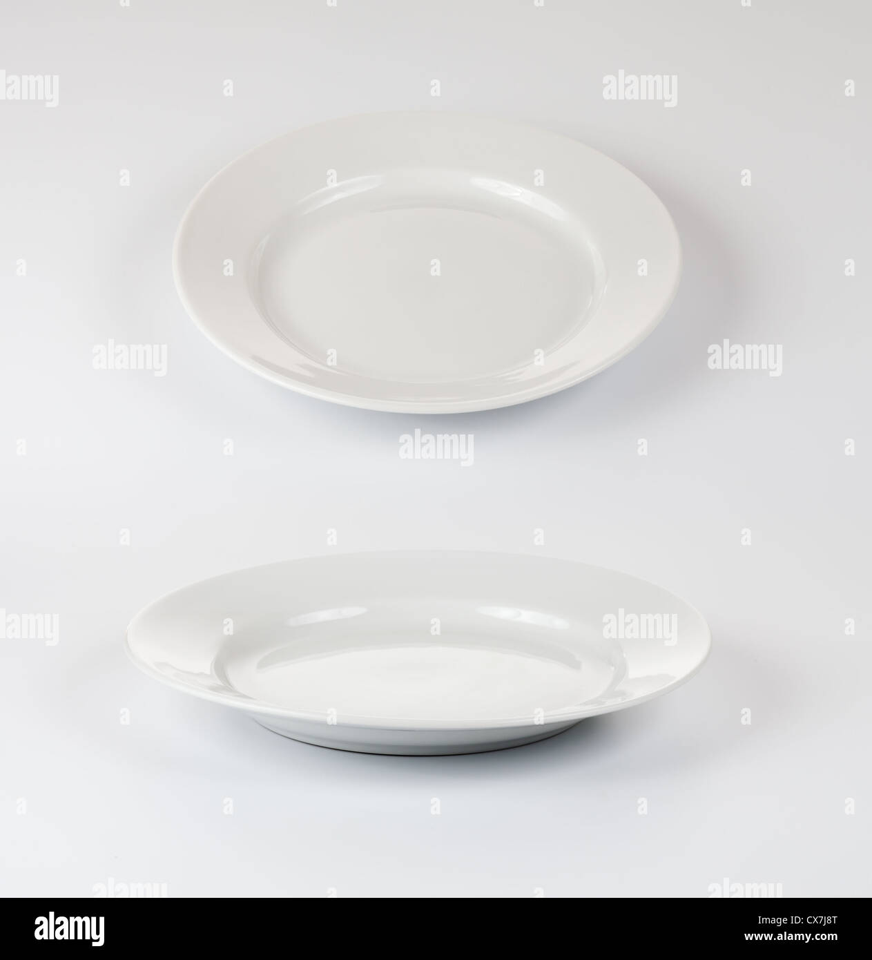 Set of round plates or dishes on white background Stock Photo - Alamy