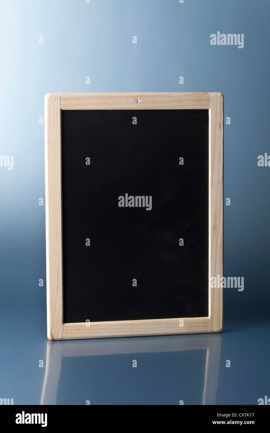 A small blank chalkboard standing upright Stock Photo - Alamy