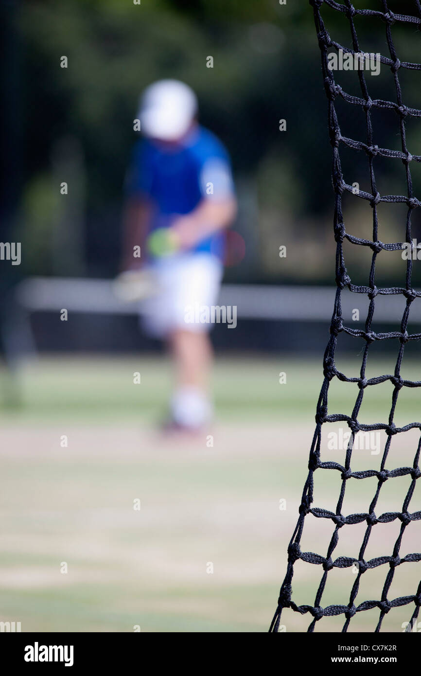 Tennis net and player Stock Photo - Alamy