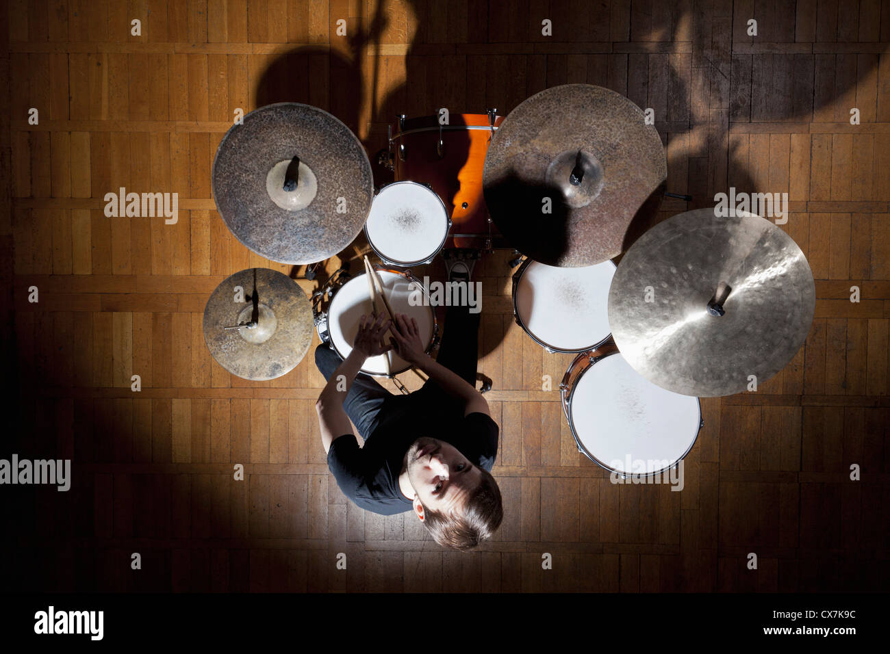 Drummer looks up Stock Photo - Alamy