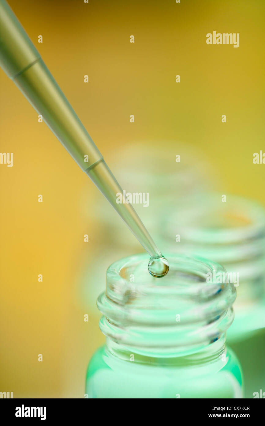 Pipette droplet over lab jar Stock Photo - Alamy