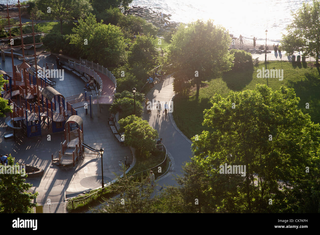 Playground and climbing frame in park by the river Stock Photo - Alamy