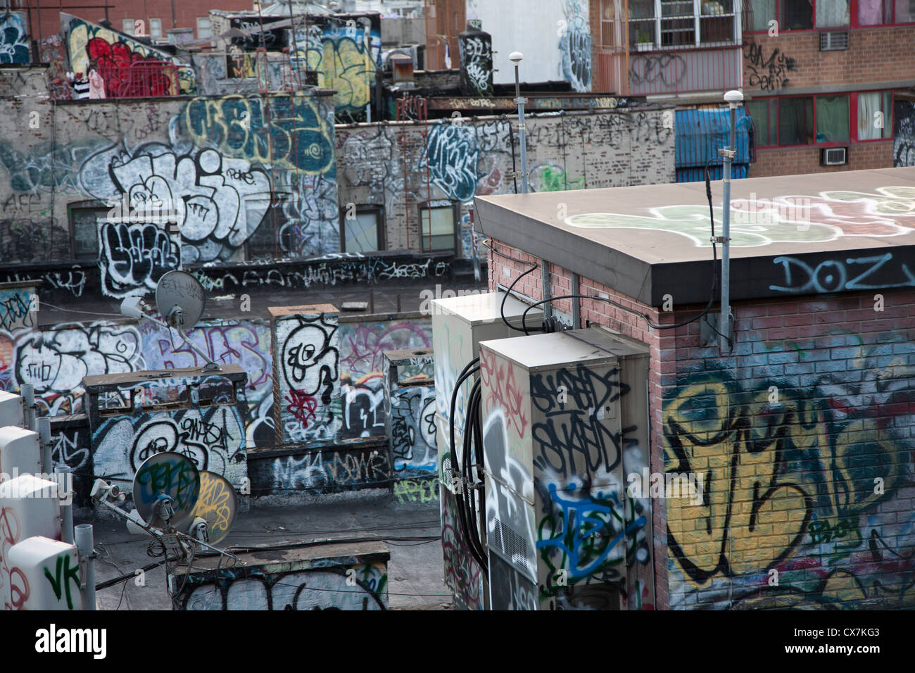 Graffiti covered tenement rooftop in Chinatown Stock Photo - Alamy