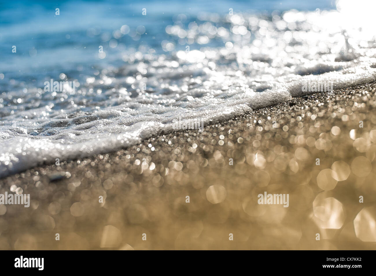 Sand beach and sea foam macro with narrow focus background Stock Photo ...