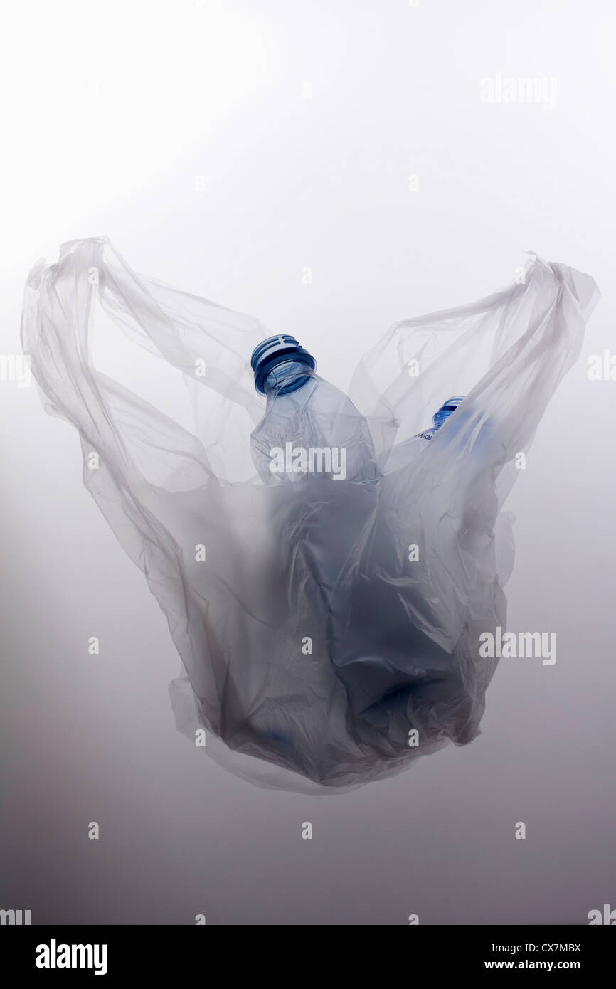 A plastic bag with two empty plastic water bottles Stock Photo - Alamy