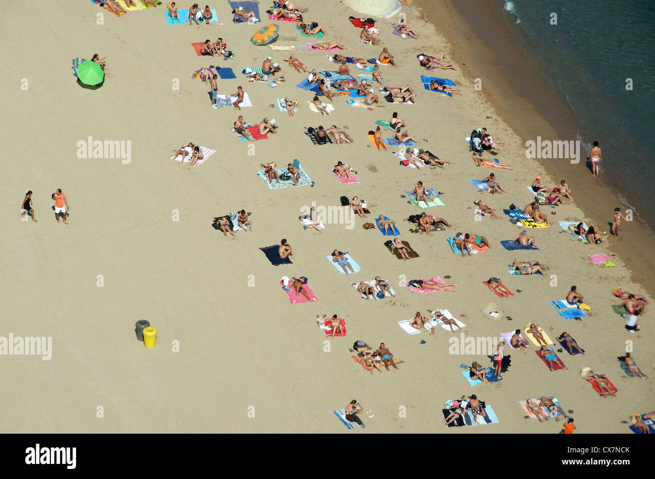 People relaxing on beach Stock Photo - Alamy
